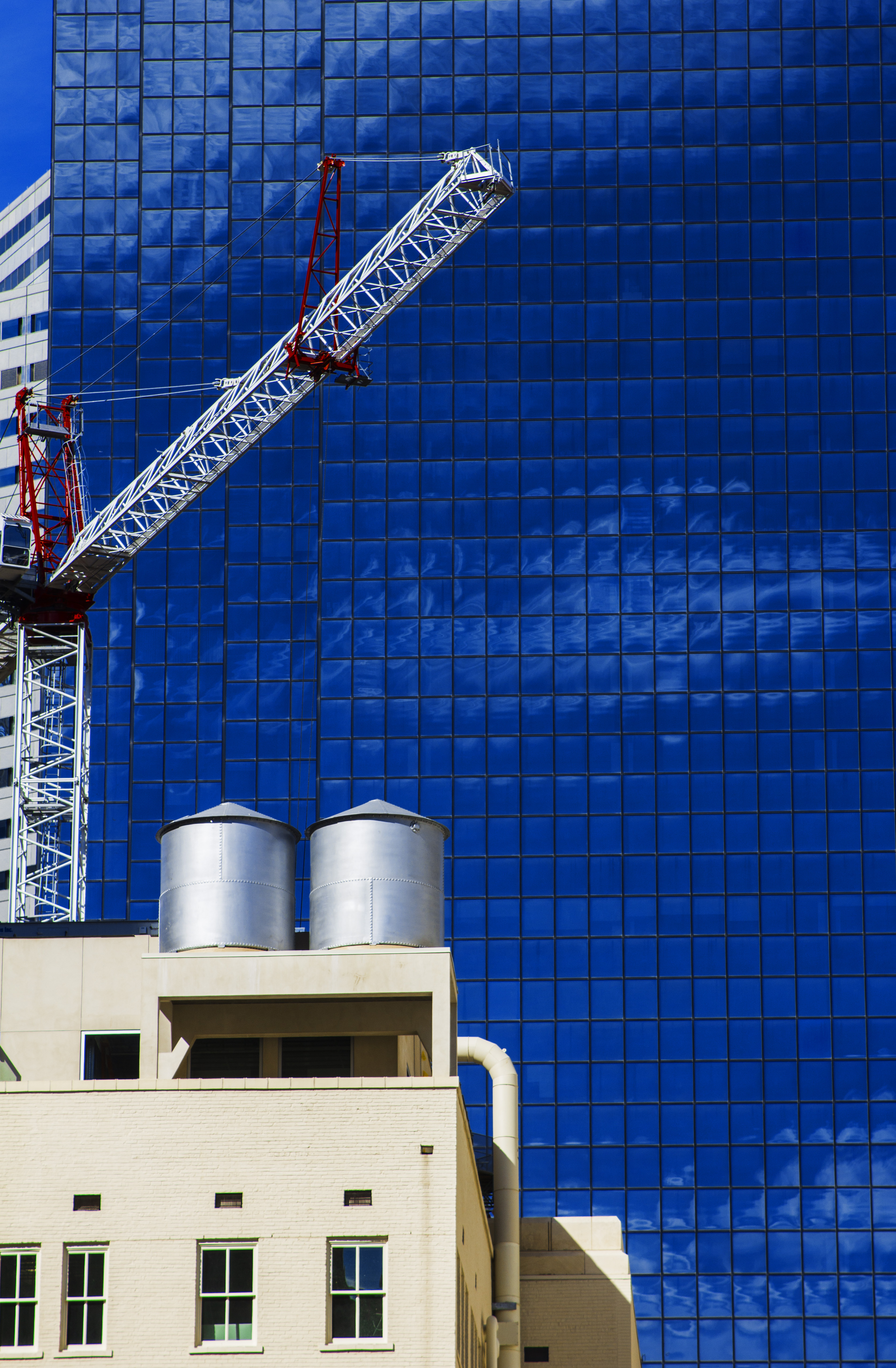 Blue Glass Building and Crane | Shutterbug